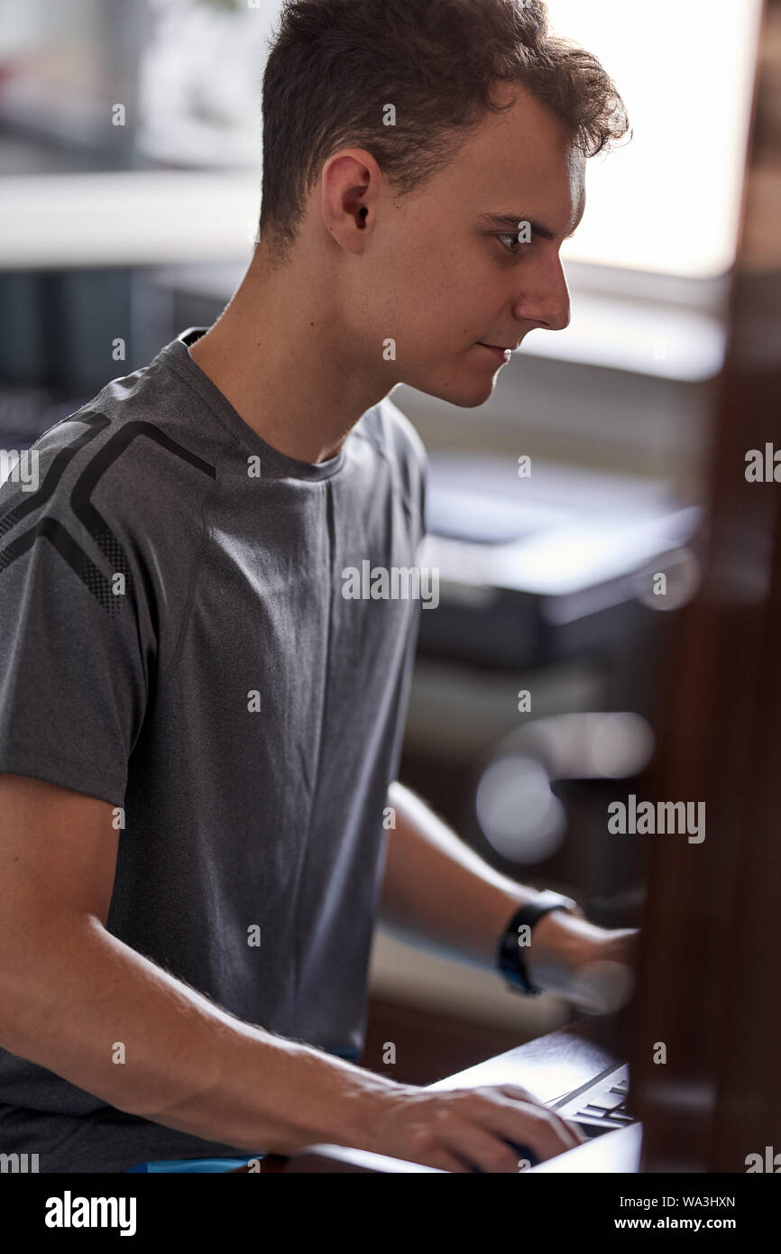 Student at his desk doing homework Stock Photo - Alamy