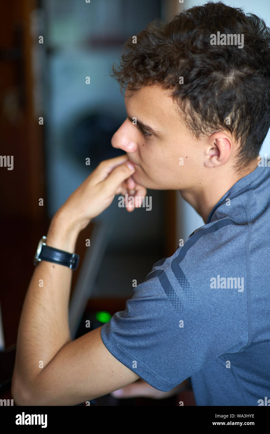 Student at his desk doing homework Stock Photo - Alamy