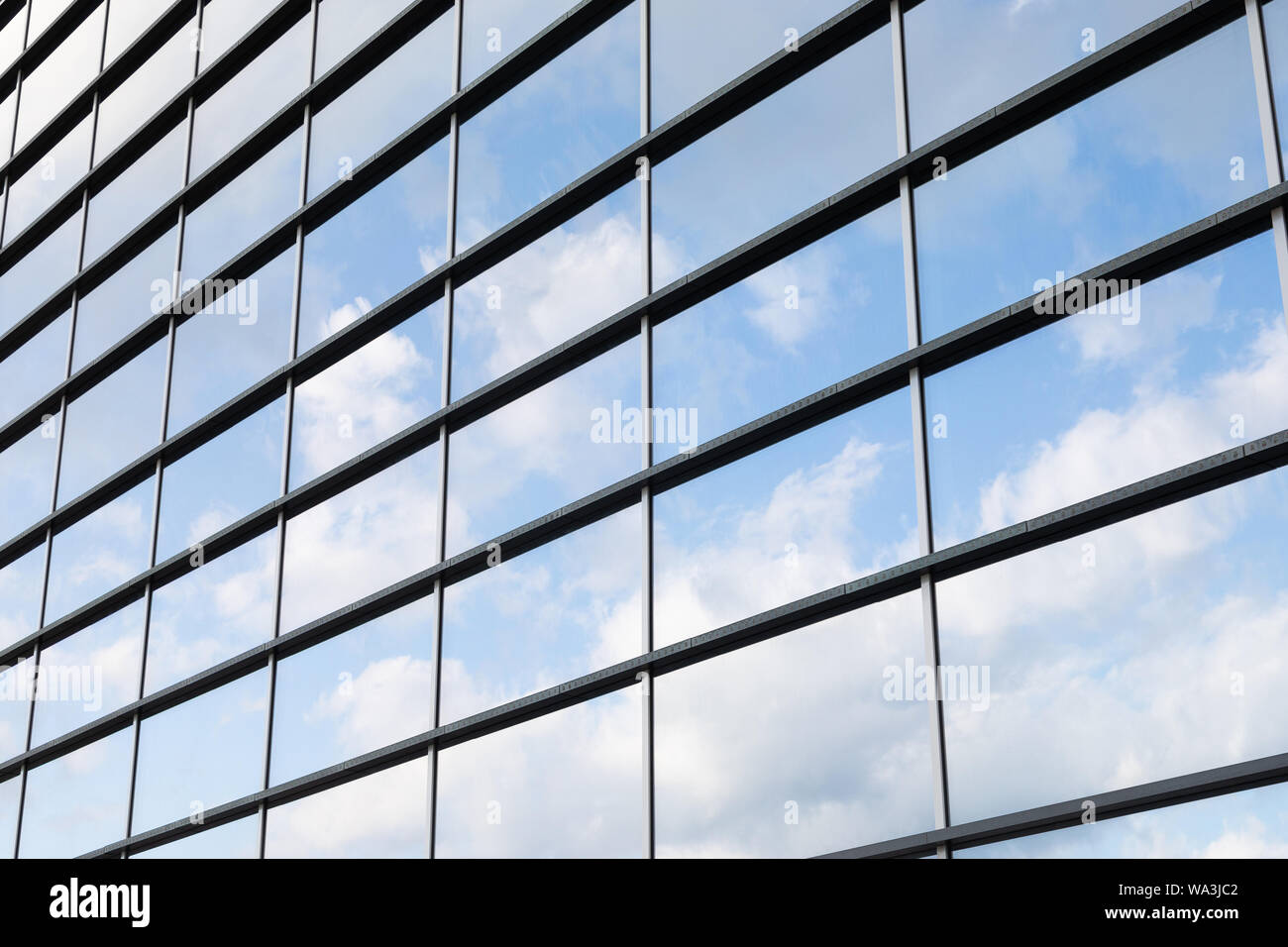 Diagonal view of wall made of glass panels Stock Photo - Alamy