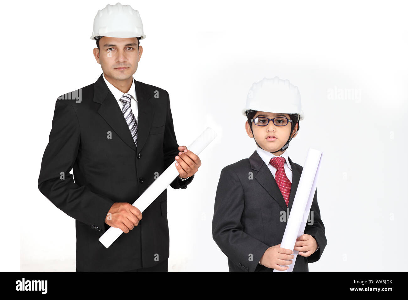 Boy imitating as architect and standing with his father Stock Photo - Alamy