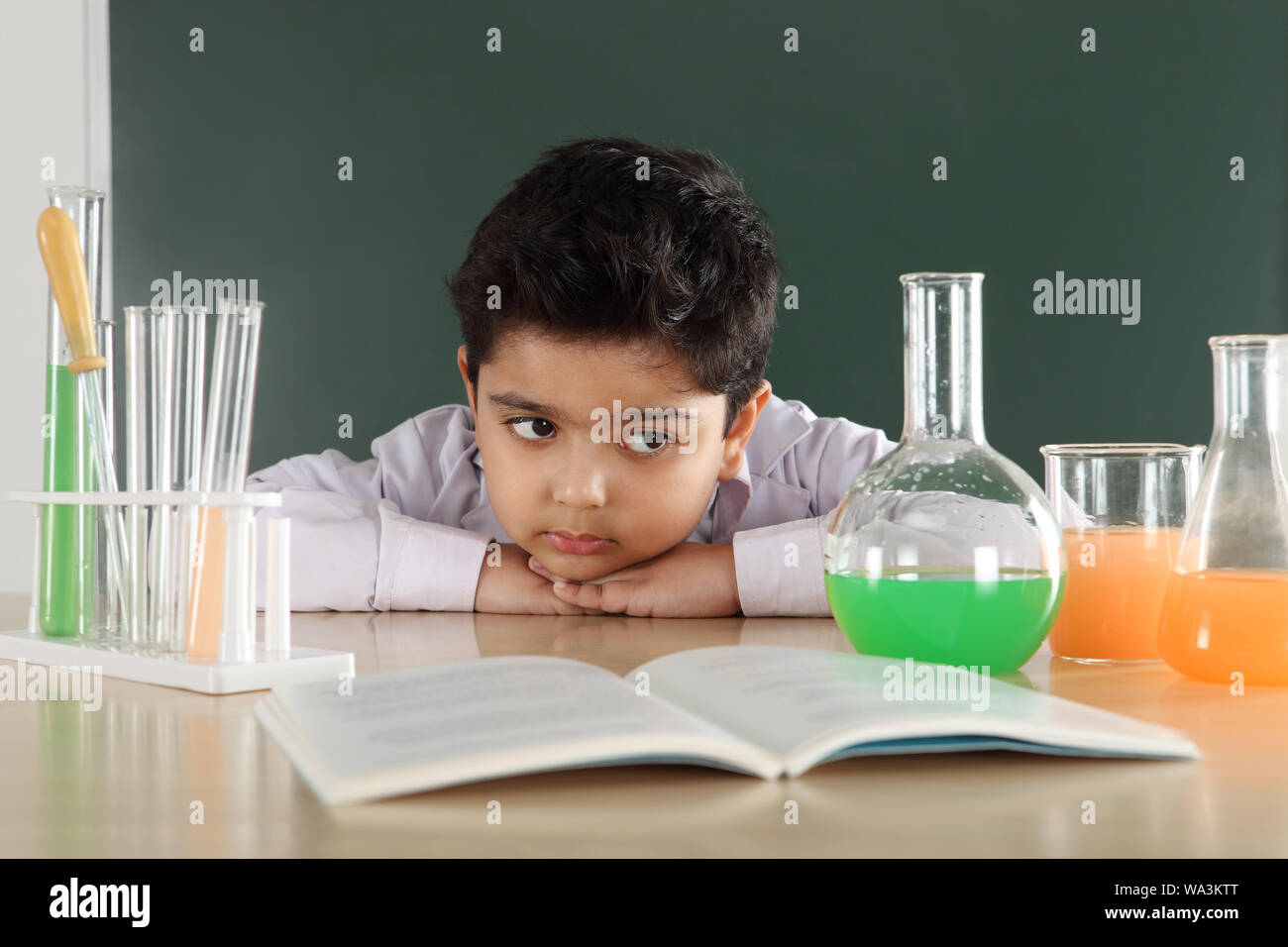 Schoolboy looking sad in a chemistry lab Stock Photo - Alamy