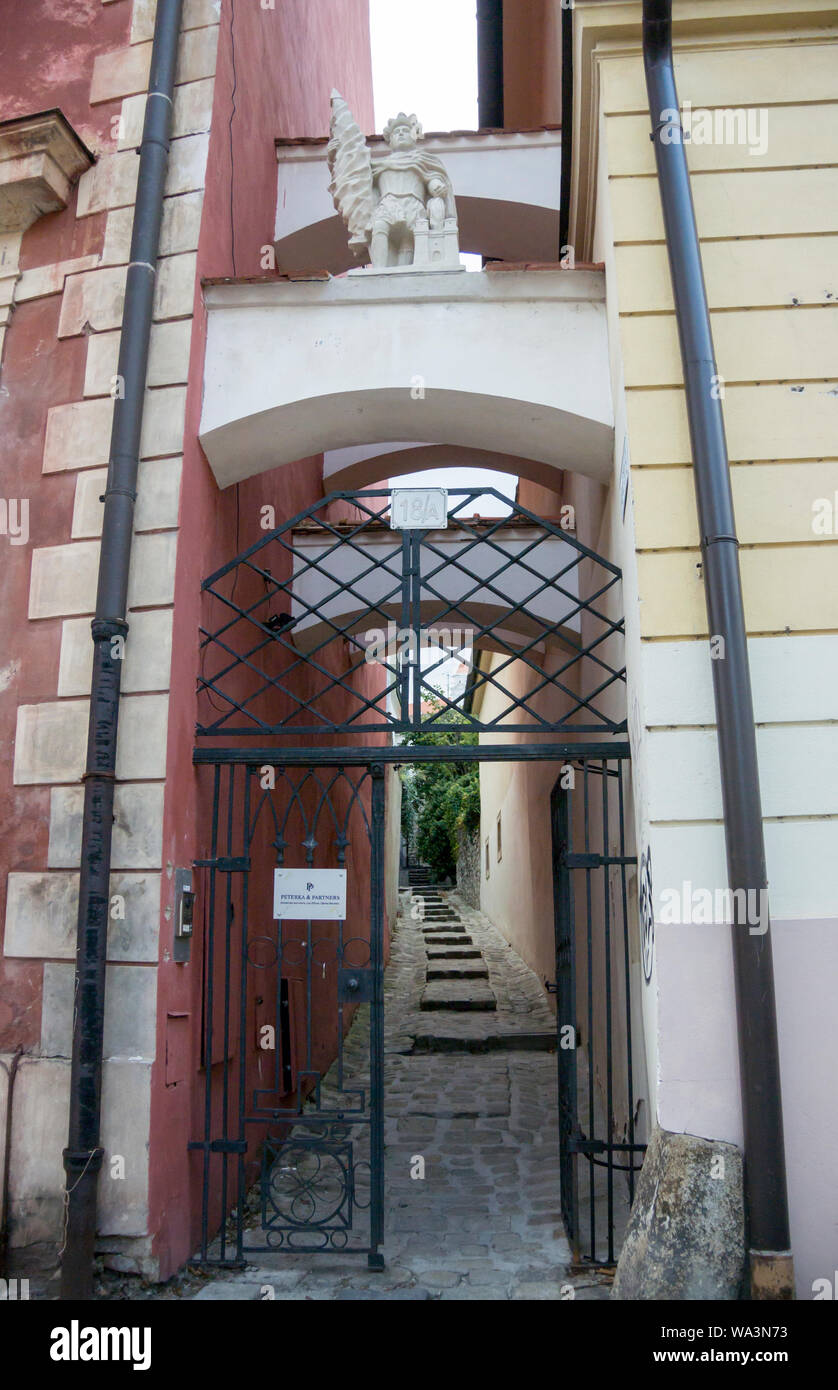 A narrow cobbled passage in the ancient city of Bratislava, Slovakia ...