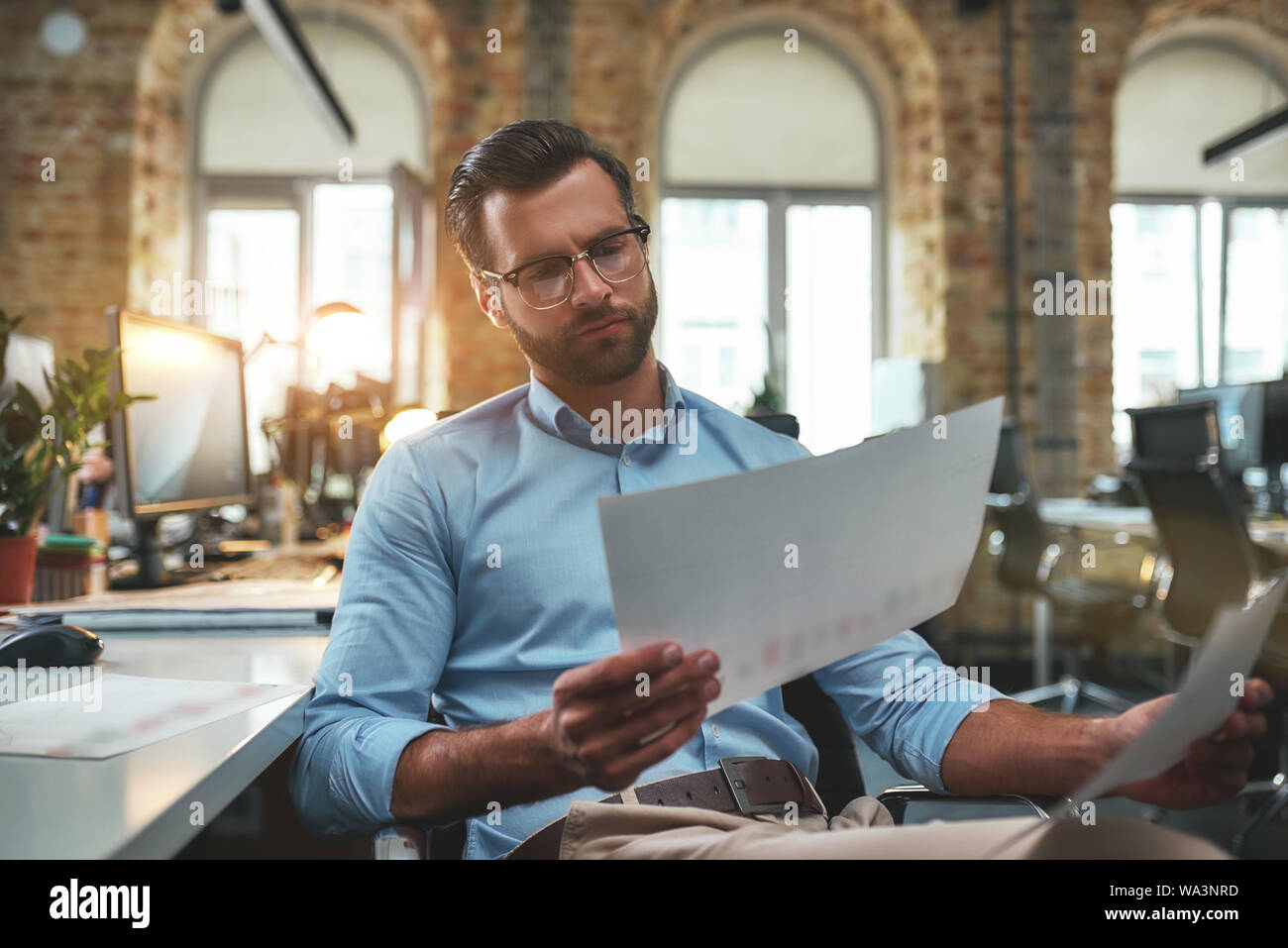 Analyzing Results Concentrated Bearded Man In Eyeglasses And Formal