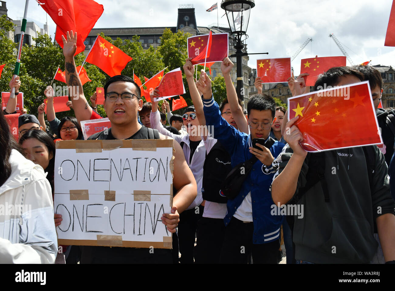 London, UK. 17th Aug, 2019. Counter Protest: Pro-China singing China ...