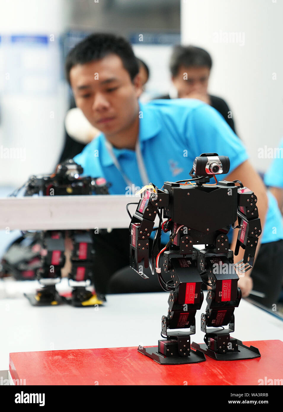 Beijing, China. 17th Aug, 2019. A team member debugs robots at the 2019 ...