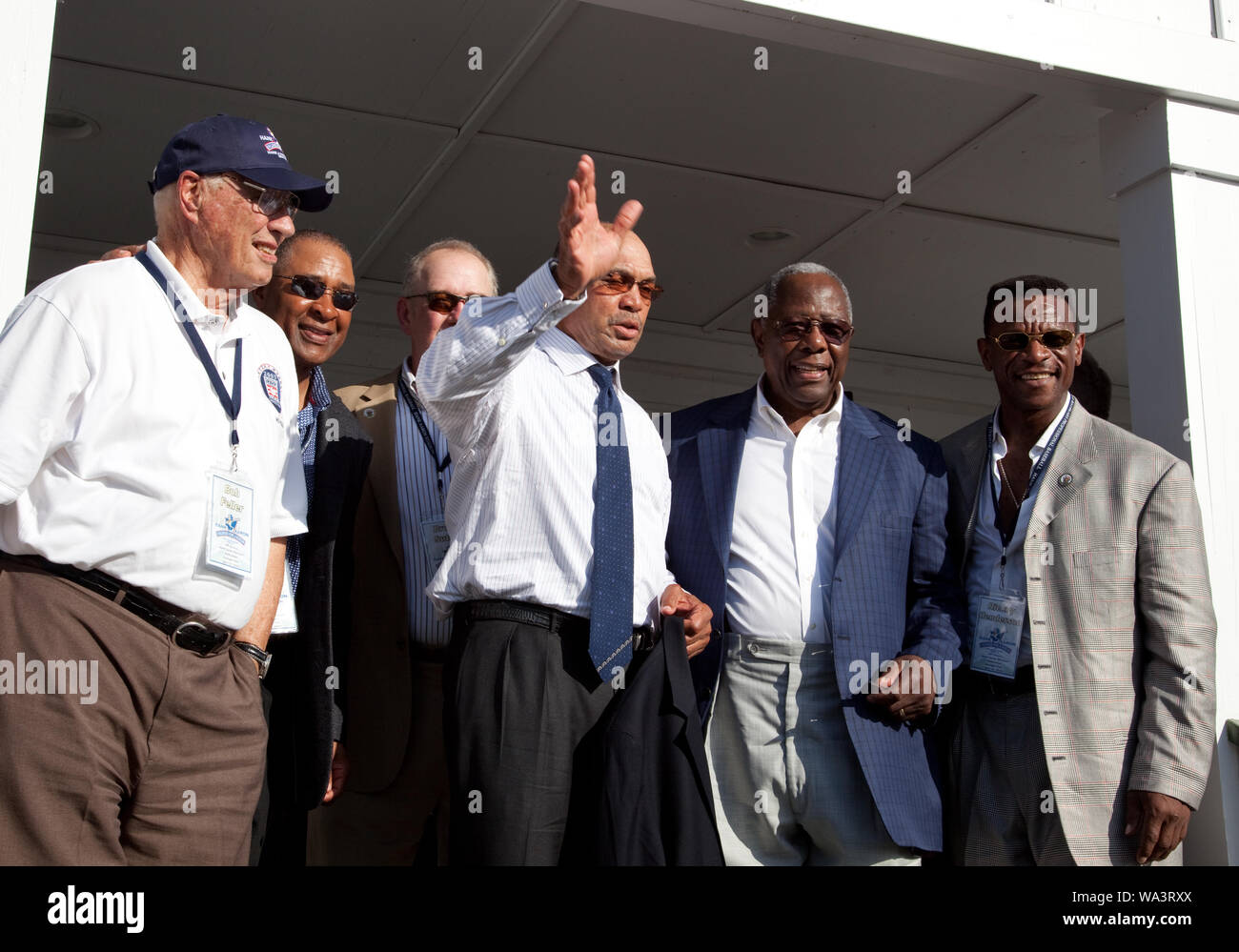 Bob Feller, Ozzie Smith, Bruce Sutter, Reggie Jackson, Hank Aaron and Rickey Henderson wave to ...