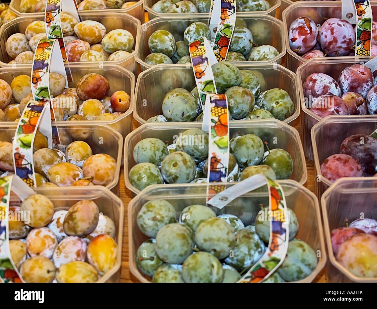 colorful ripe plums on a pile in boxes Stock Photo - Alamy
