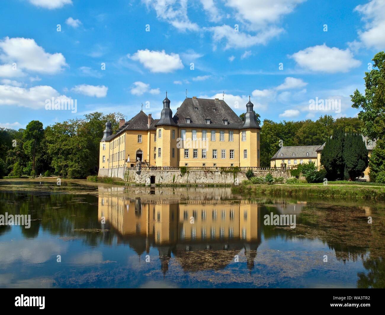 Romantic yellow water castle Schloss Dyck in Juechen in Germany Stock ...