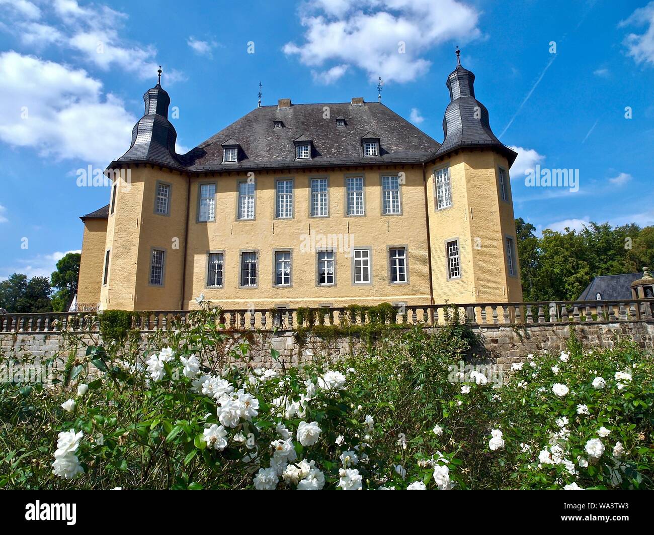 Romantic yellow water castle Schloss Dyck in Juechen in Germany Stock ...