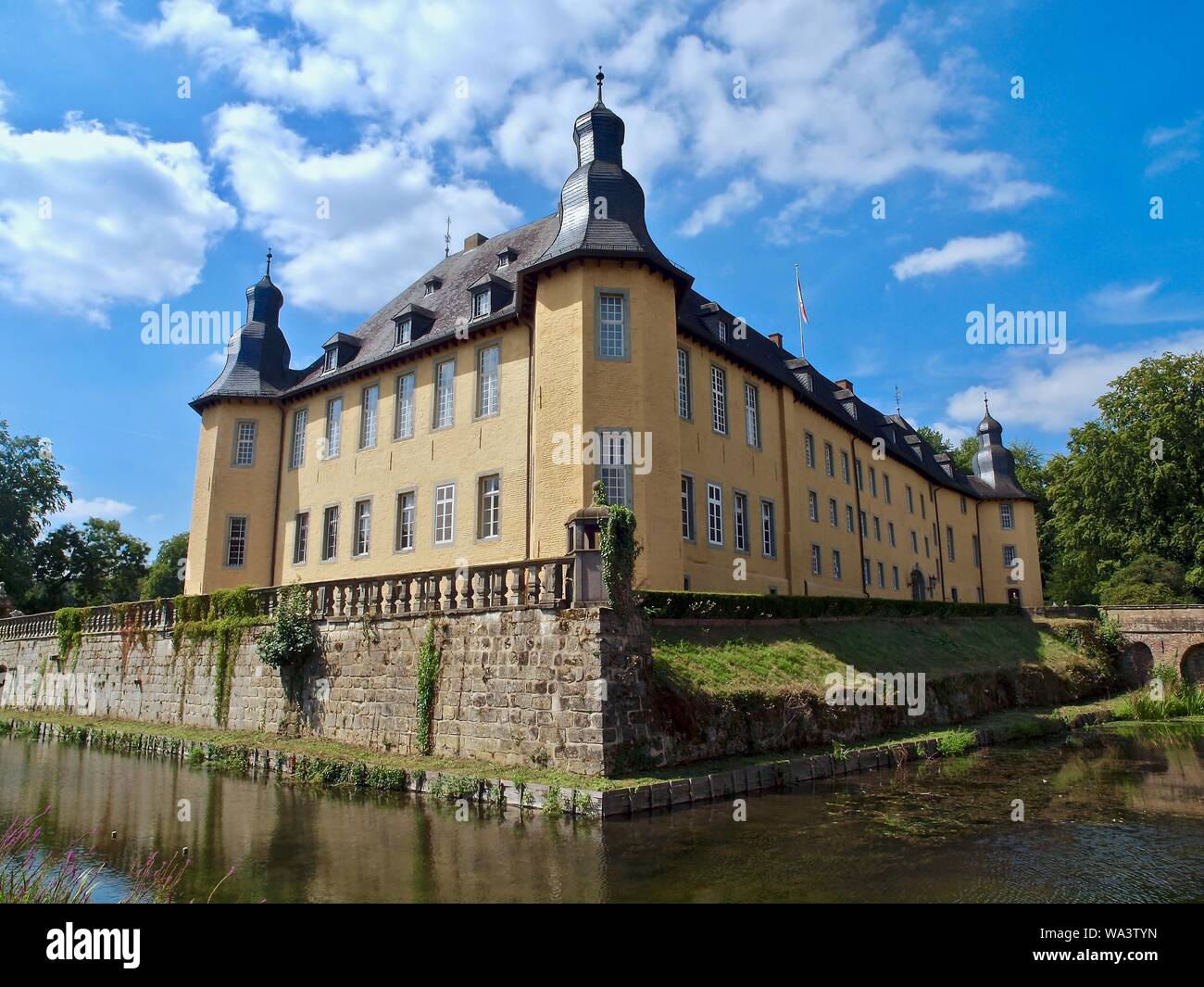 Romantic yellow water castle Schloss Dyck in Juechen in Germany Stock ...