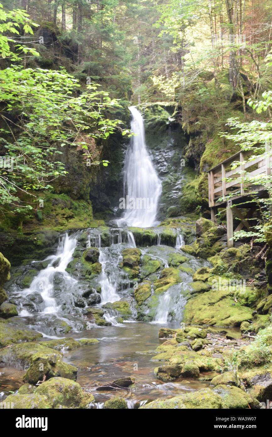 Waterfall cascading over rocks Stock Photo - Alamy