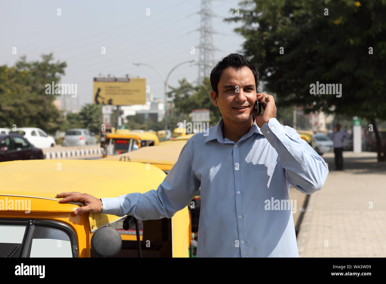 Indian man on phone on road hi-res stock photography and images - Alamy