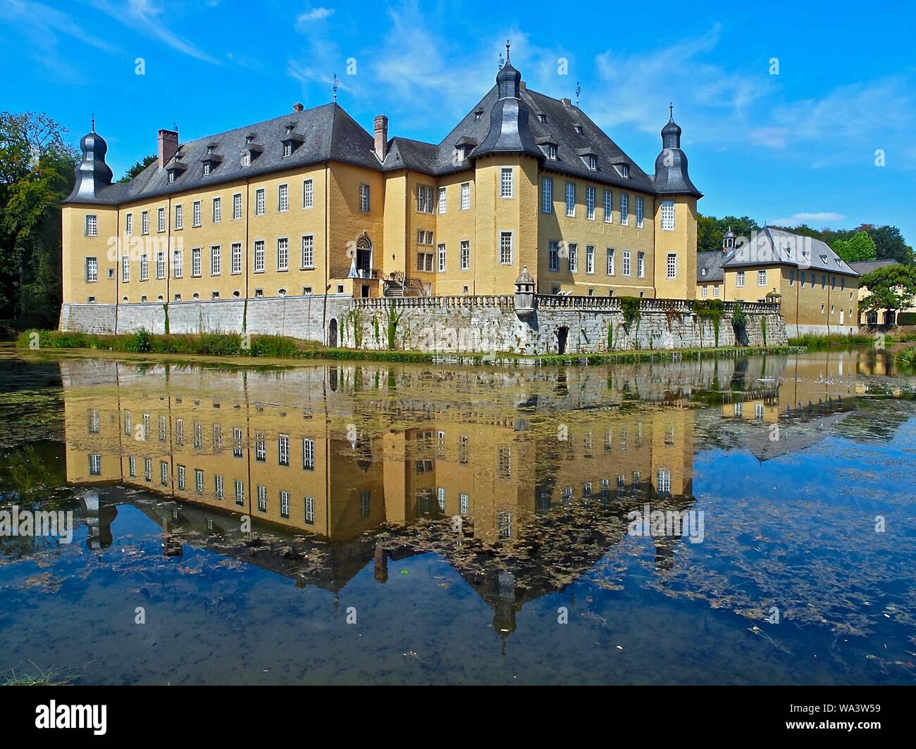 Romantic yellow water castle Schloss Dyck in Juechen in Germany Stock ...