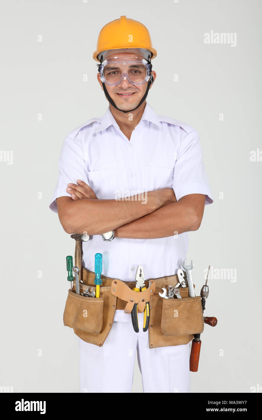 Electrician standing with his arms crossed Stock Photo - Alamy