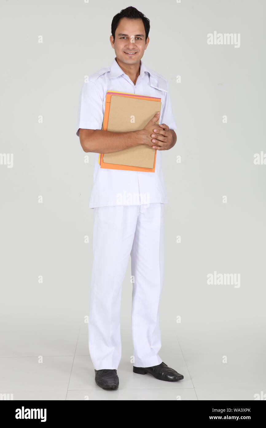 Peon holding files in office Stock Photo - Alamy
