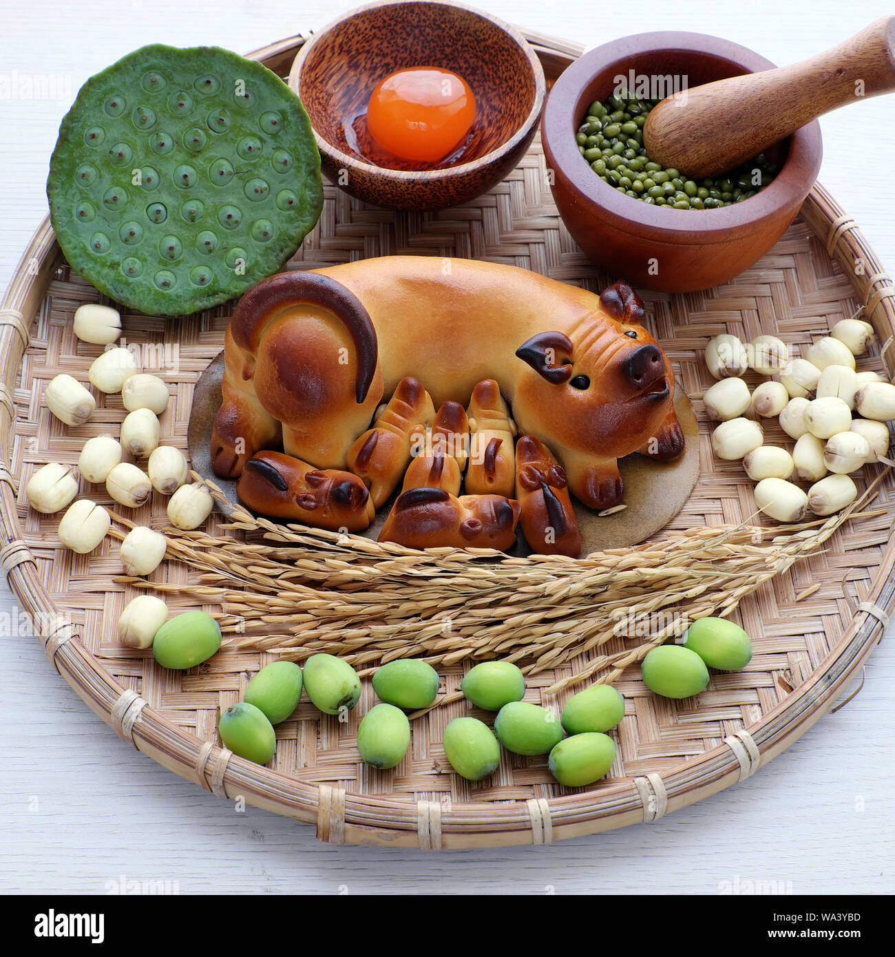 Top view of moon cake mother pig and piglets, baking materials, paper ...