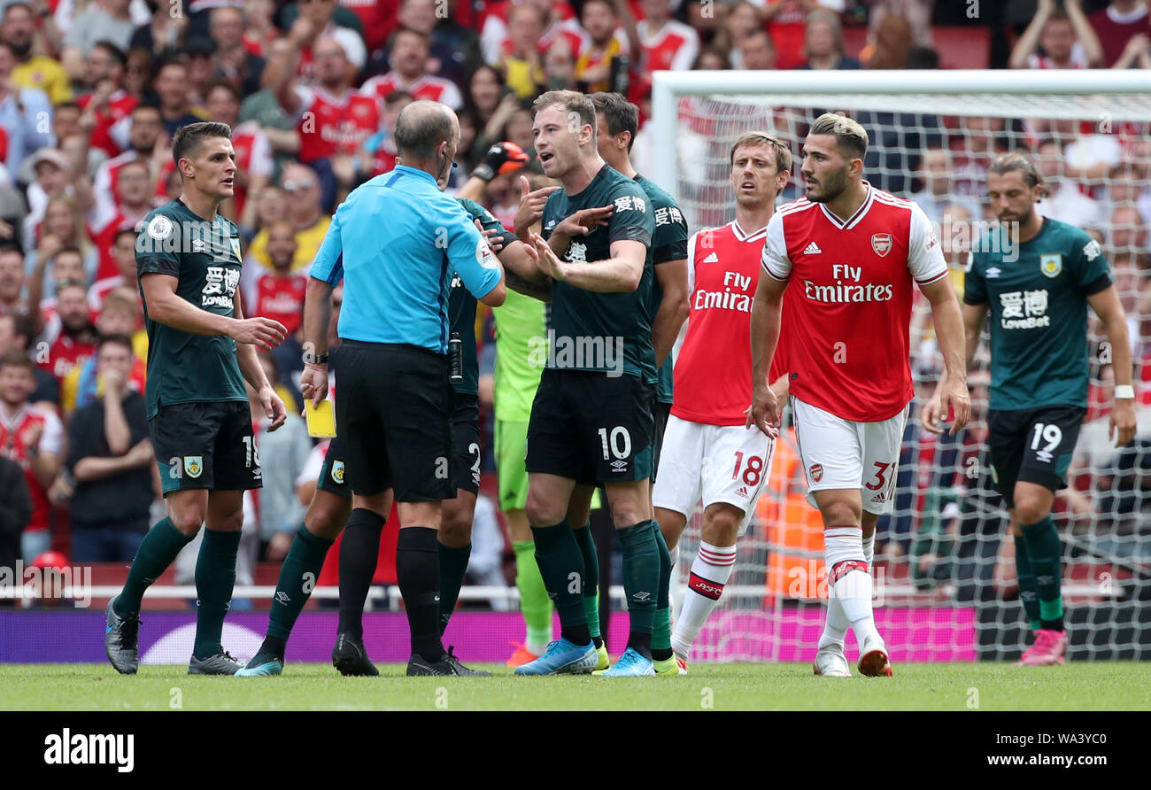 Burnley's Ashley Barnes argues with referee Mike Dean during the ...