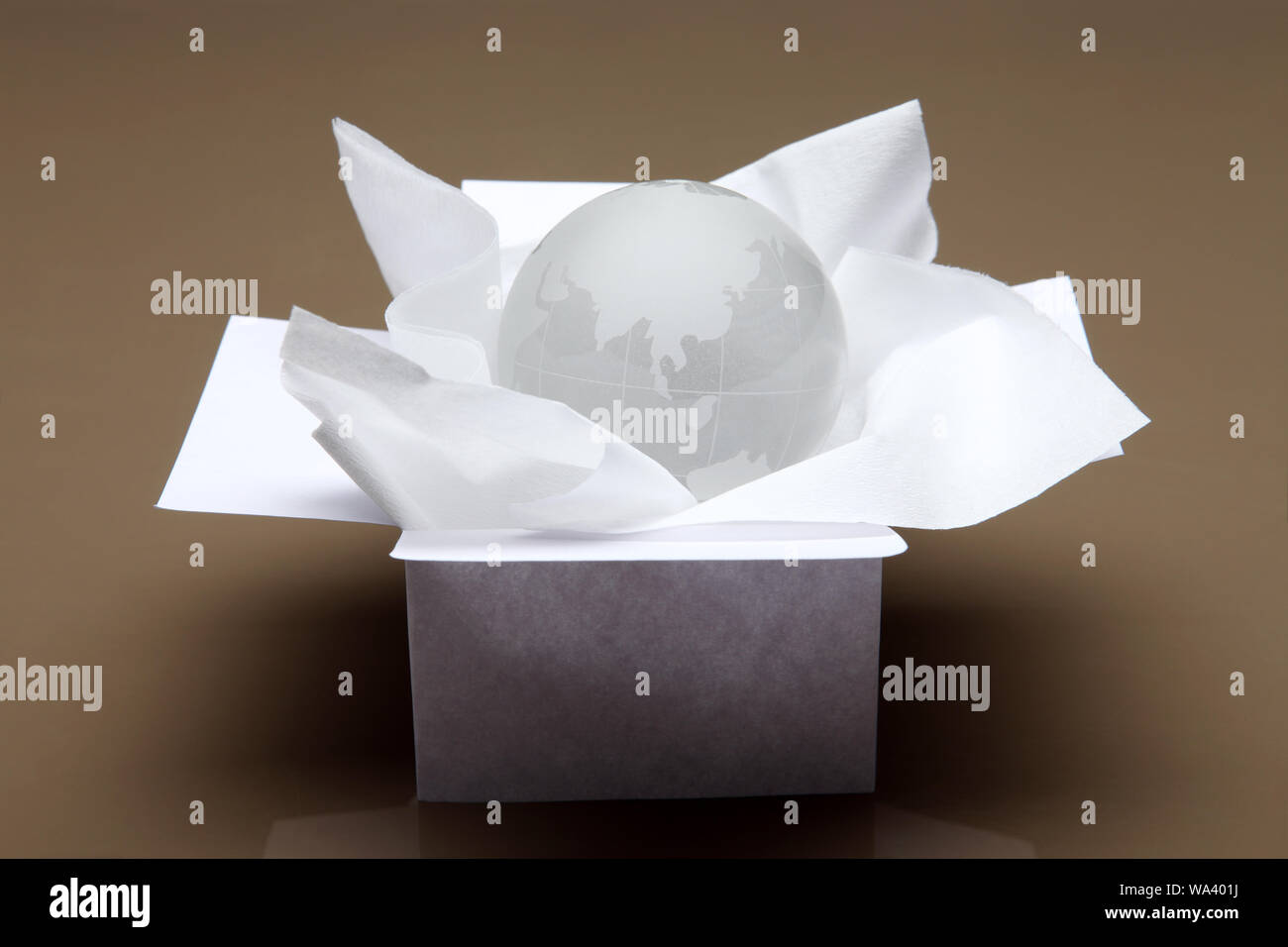 Close up of globe in a gift box Stock Photo - Alamy