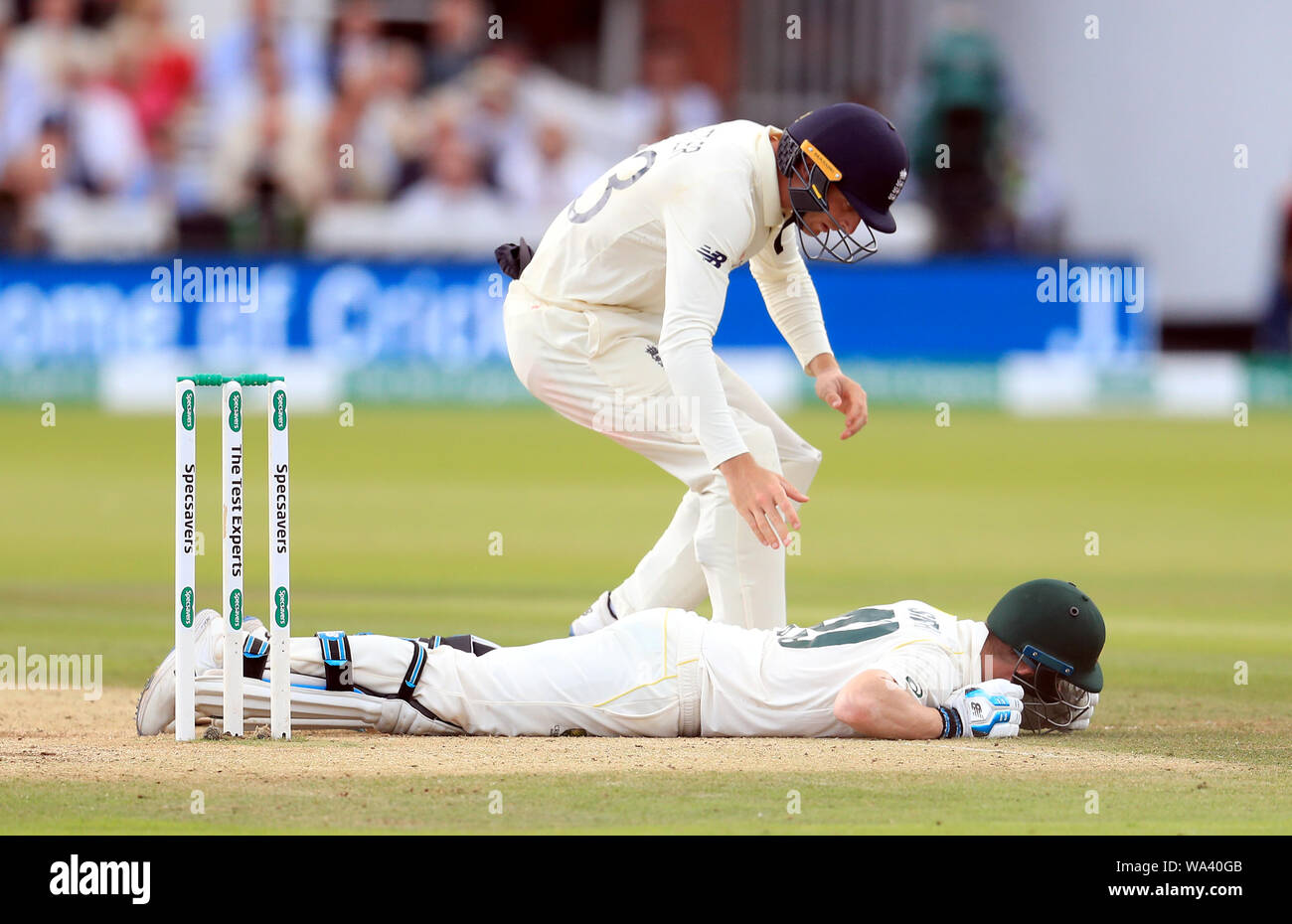 Australia's Steve Smith ends up on the floor after being hit by the ...
