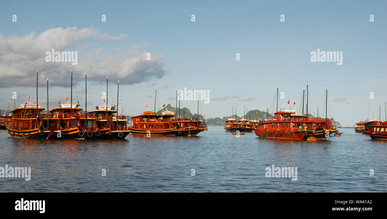 Small wooden tourist boats at the famous Halong Bay in Vietnam Asia ...