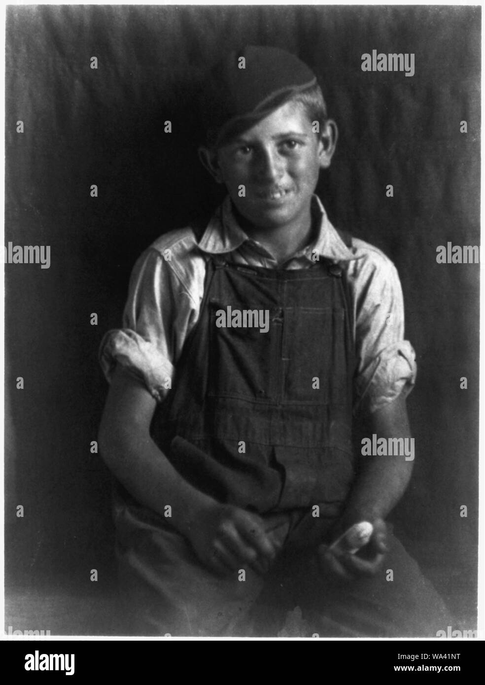 Boy in overalls Black and White Stock Photos & Images - Alamy