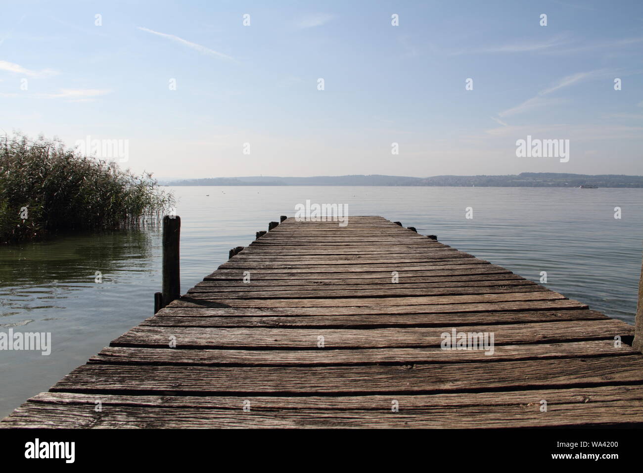 wooden pier on the water Stock Photo - Alamy