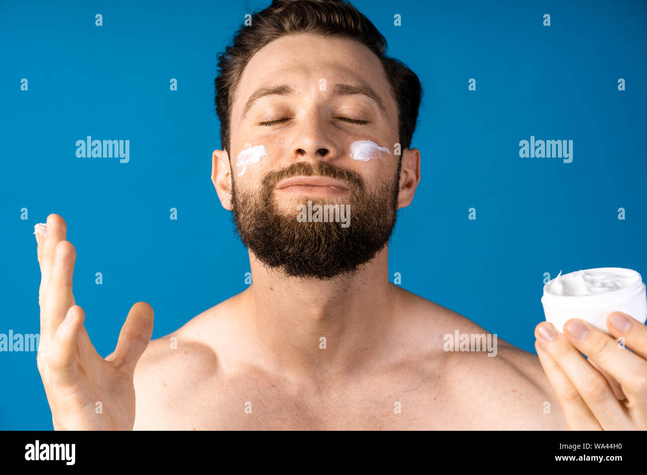 Concentrated relaxed man standing with closed eyes, having relaxation ...