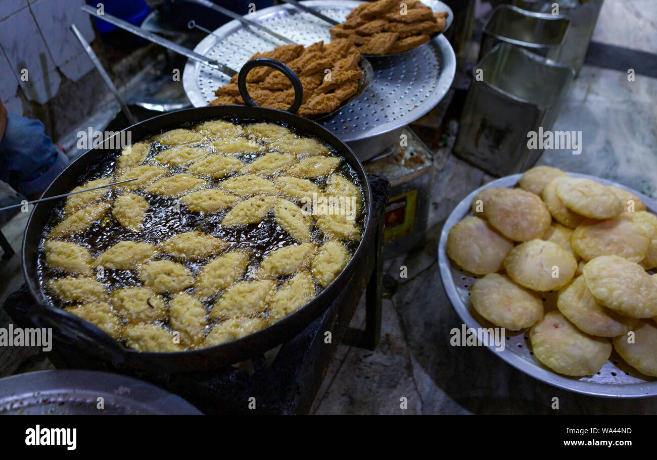 deep fried sweets cooked in an iron pan in Asia Stock Photo - Alamy