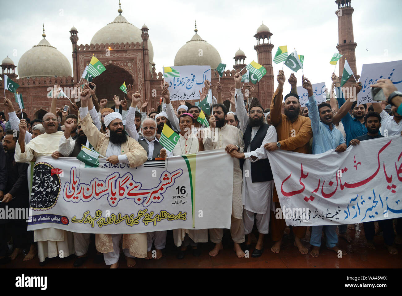 Pakistani activists of Majlis-e-Ulma Pakistan holding national and ...