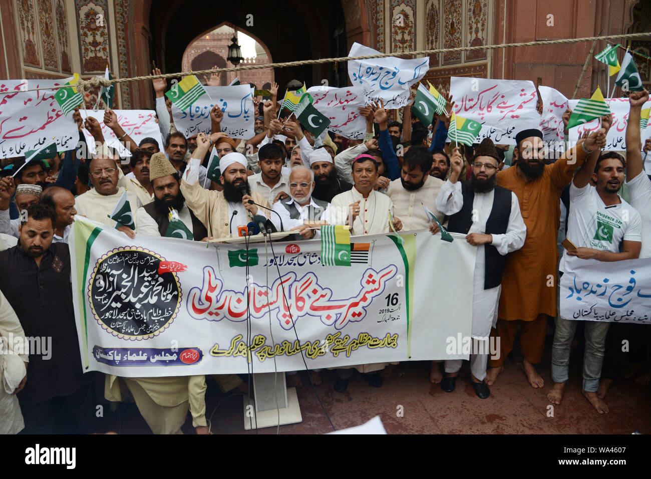 Pakistani activists of Majlis-e-Ulma Pakistan holding national and ...