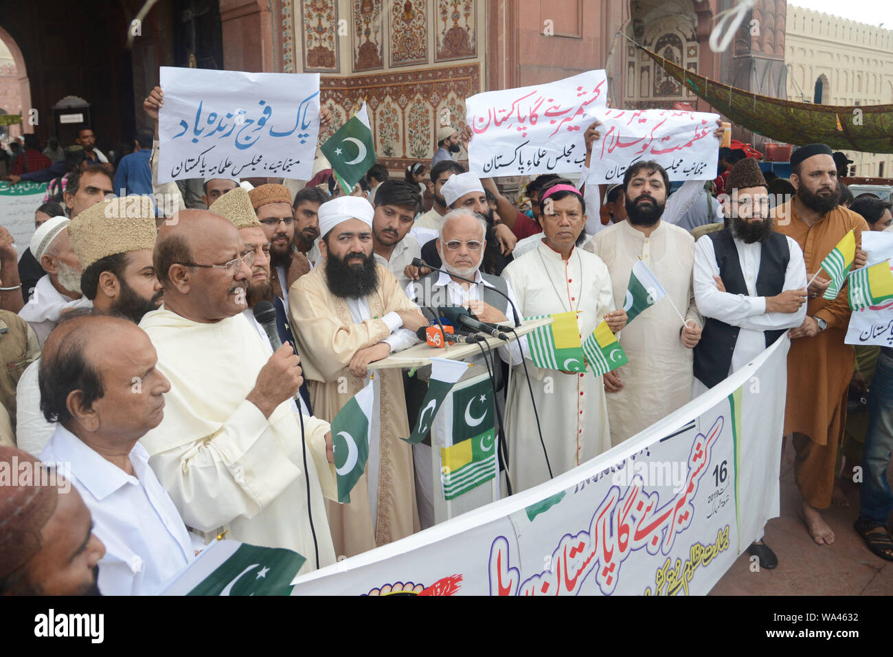 Pakistani activists of Majlis-e-Ulma Pakistan holding national and ...