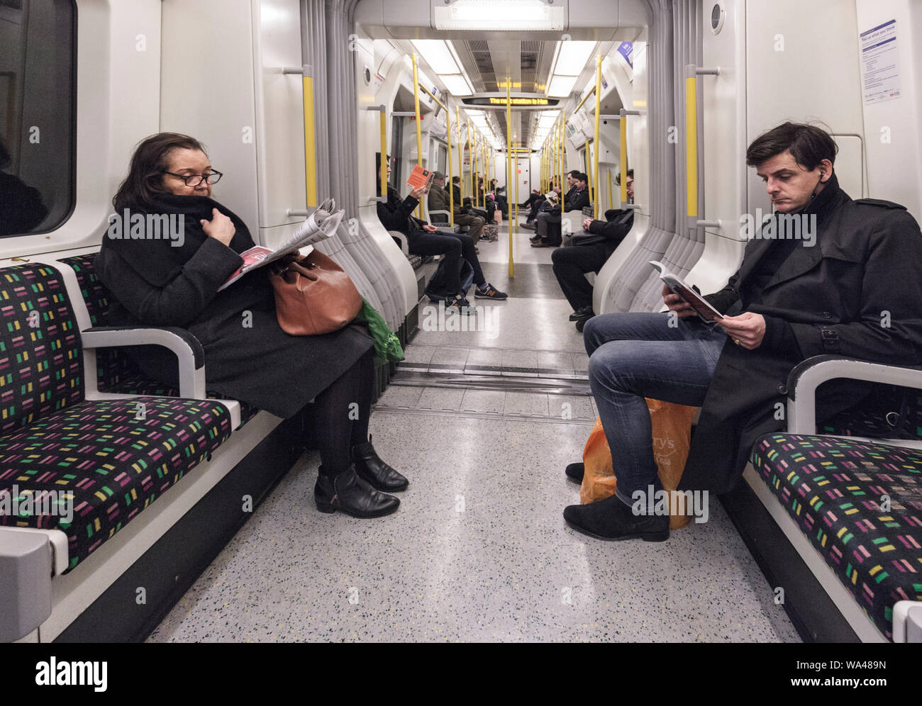 Reading on subway hi-res stock photography and images - Alamy