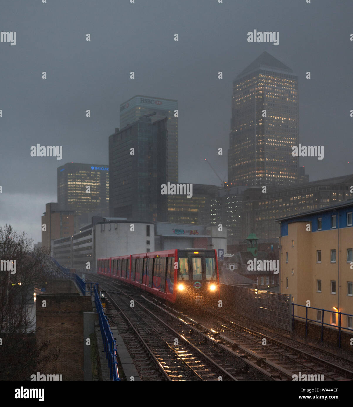 Westferry, London Docklands Light Railway 111 + 136 + 104 arriving on a ...