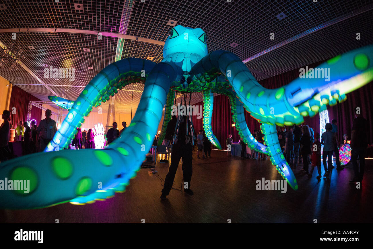 Hanover, Germany. 17th Aug, 2019. An exhibitor presents in a "Dark ...
