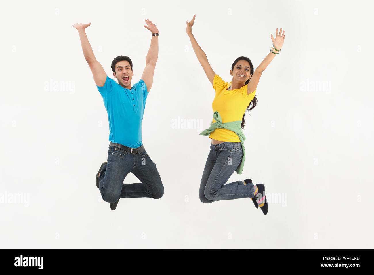 Young couple jumping in air Stock Photo - Alamy
