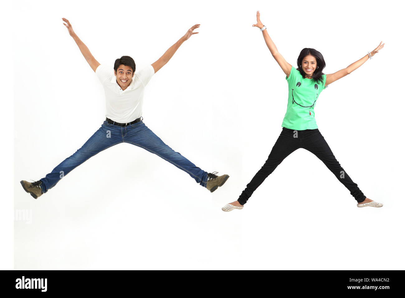 Young couple jumping in air Stock Photo - Alamy