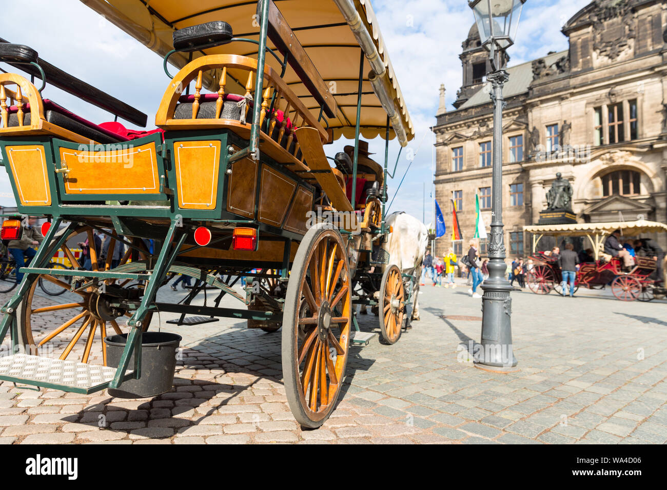 Excursion wagon with a horse in old European town Stock Photo - Alamy
