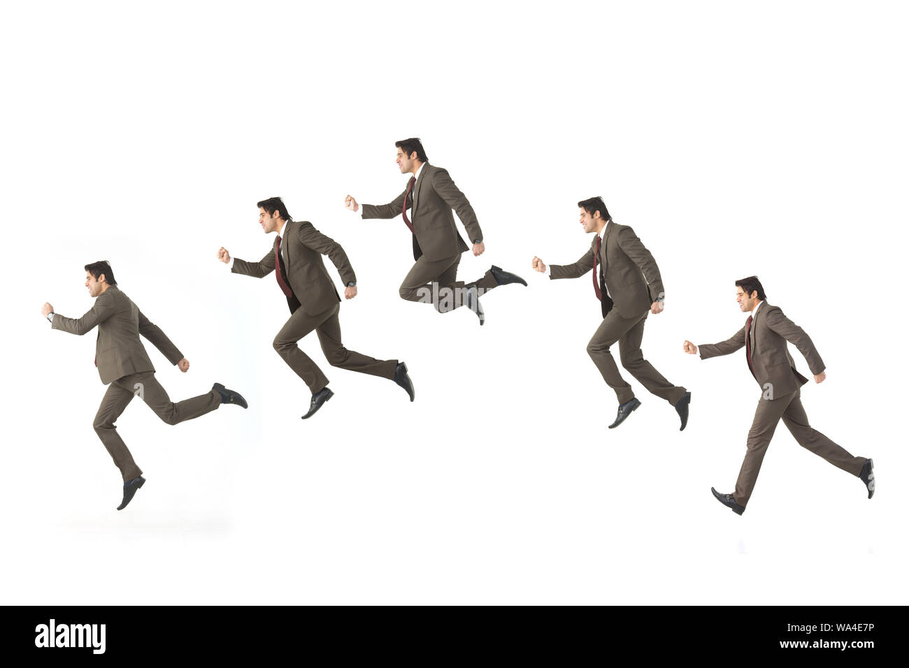 Multiple images of a businessman jumping in air Stock Photo - Alamy