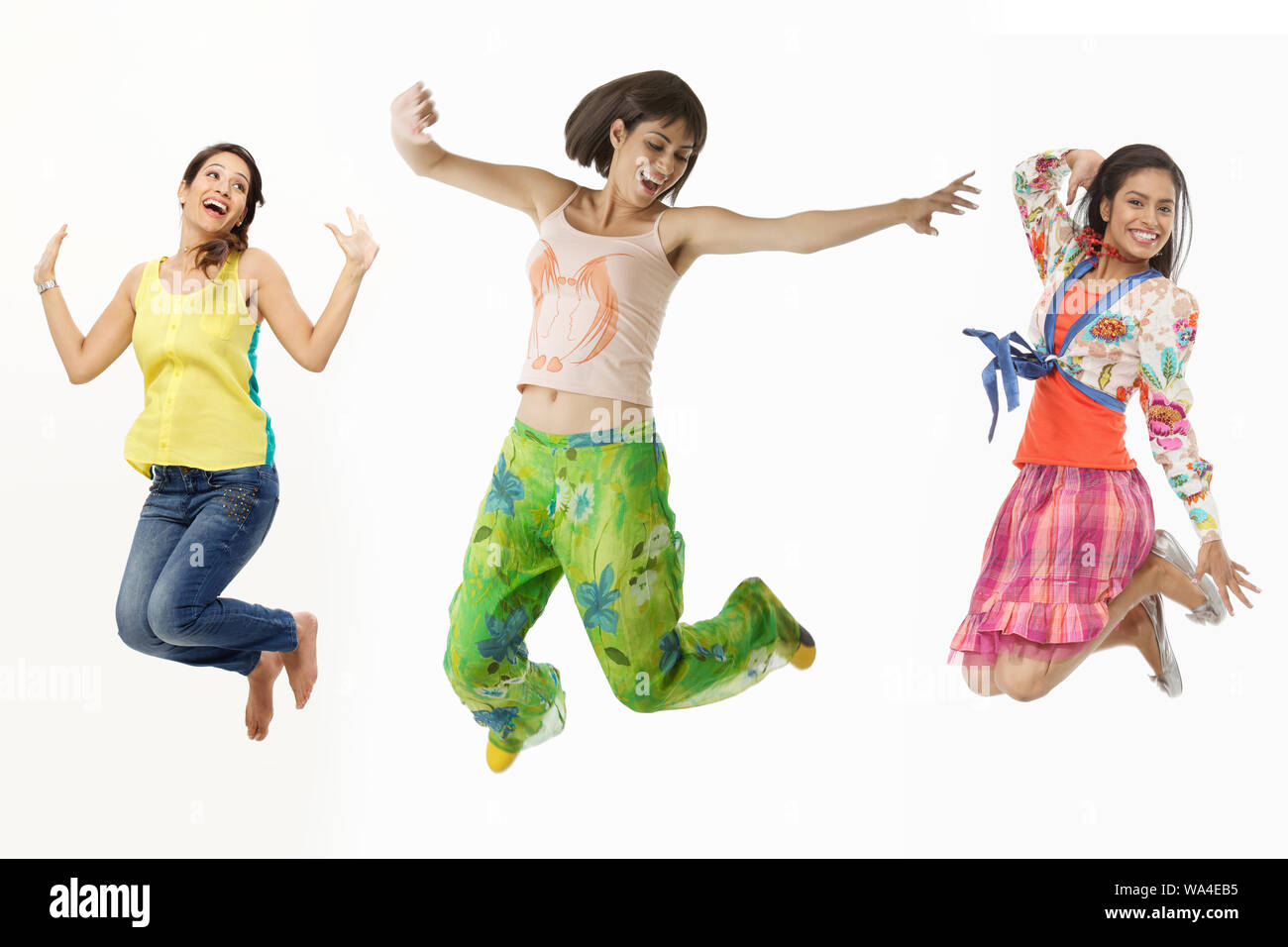 Young women jumping in air Stock Photo - Alamy