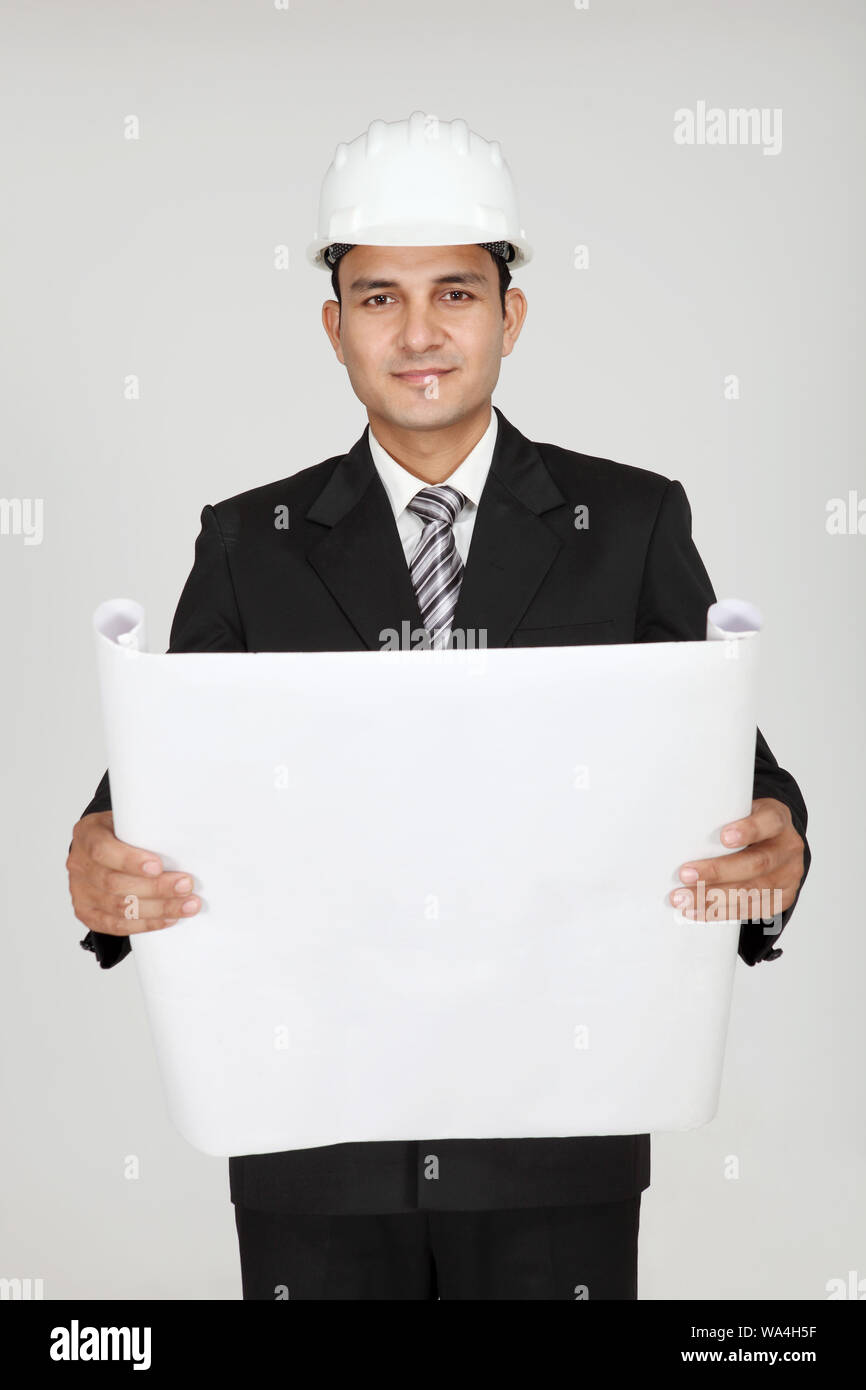 Architect holding a blueprint Stock Photo - Alamy