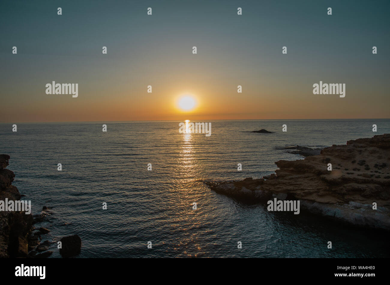The sunset under the beautiful blue sky on beach Stock Photo - Alamy