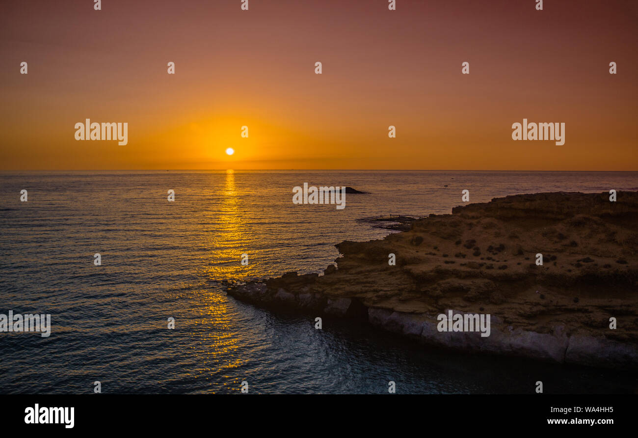 The sunset under the beautiful blue sky on beach Stock Photo - Alamy