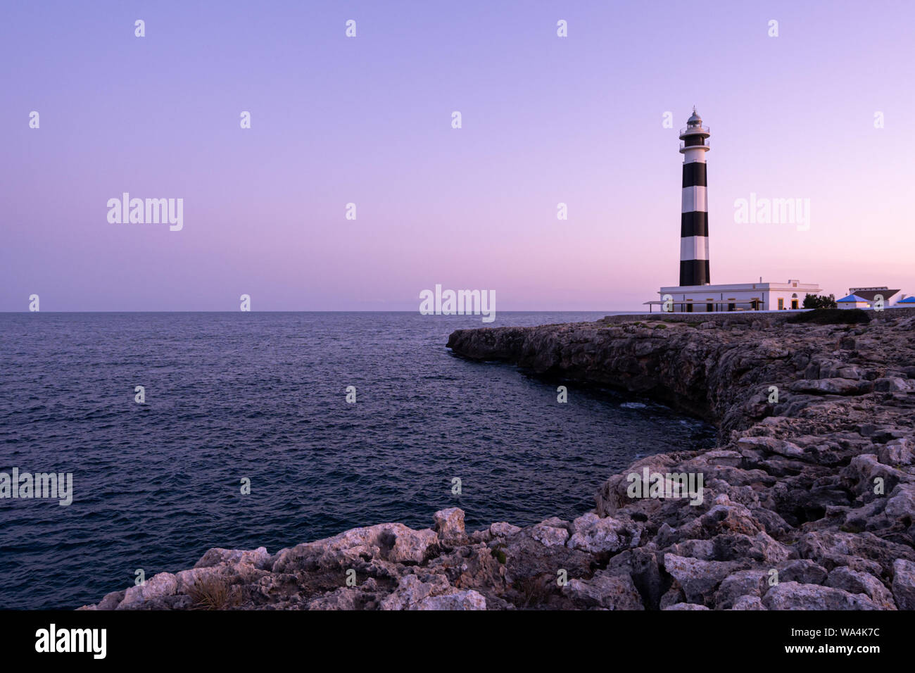 The Cap Artrutx Lighthouse on the Spanish mediterranean island of Menorca Stock Photo - Alamy