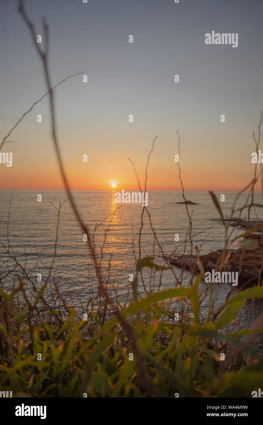 The sunset under the beautiful blue sky on beach Stock Photo - Alamy