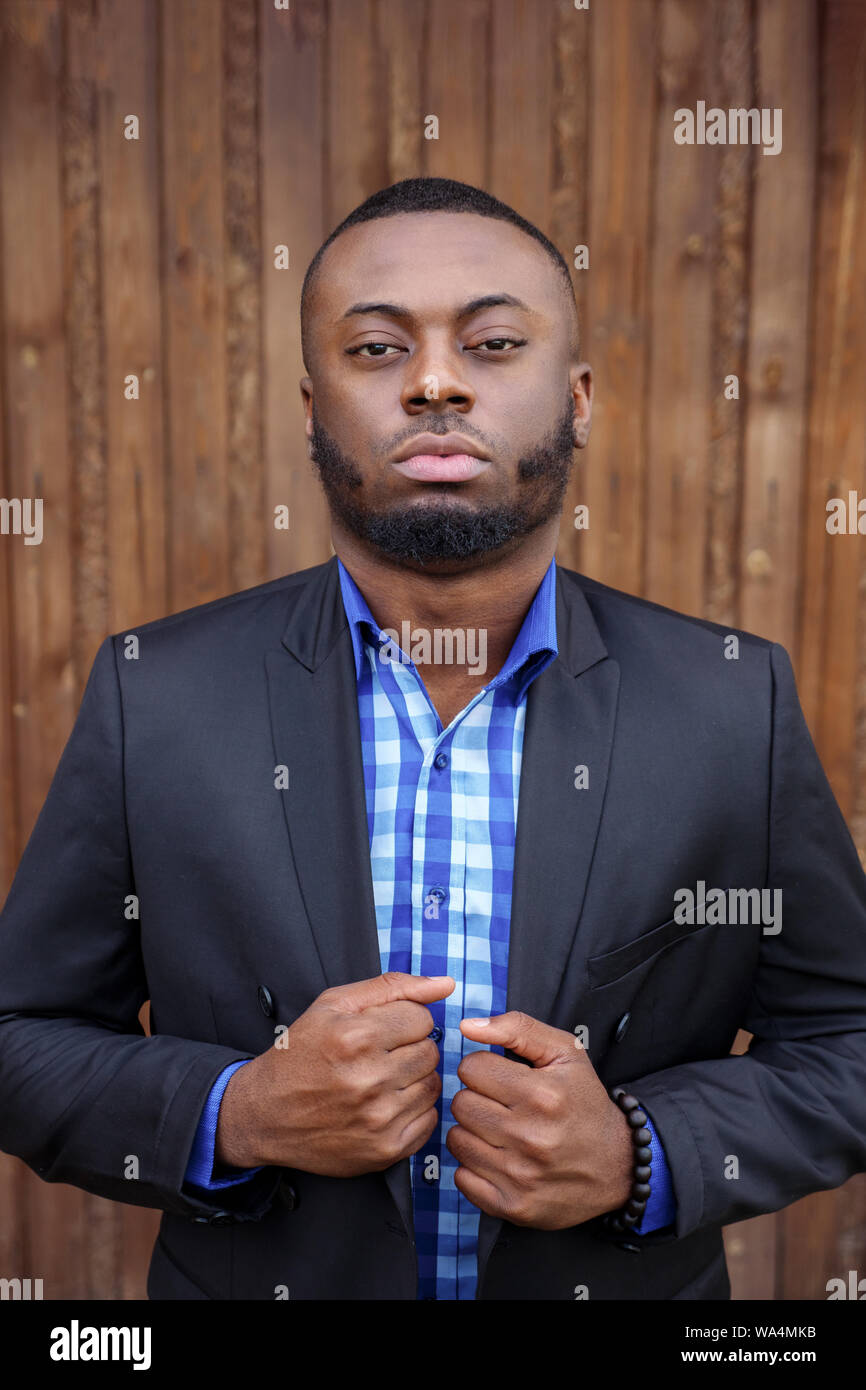 Portrait of young black bearded guy. Afro american man in suit is ...