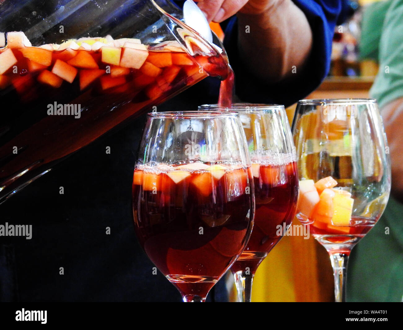 Serving sangria glasses at Mexican restaurant Stock Photo - Alamy