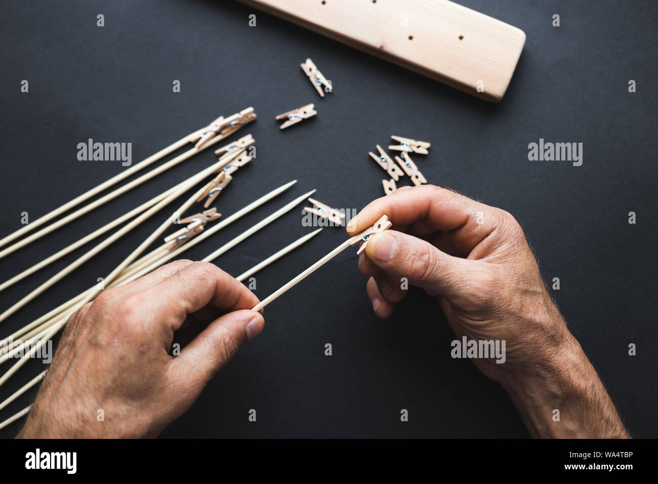 glue together wooden clothespins and sticks, make a holder for photos ...