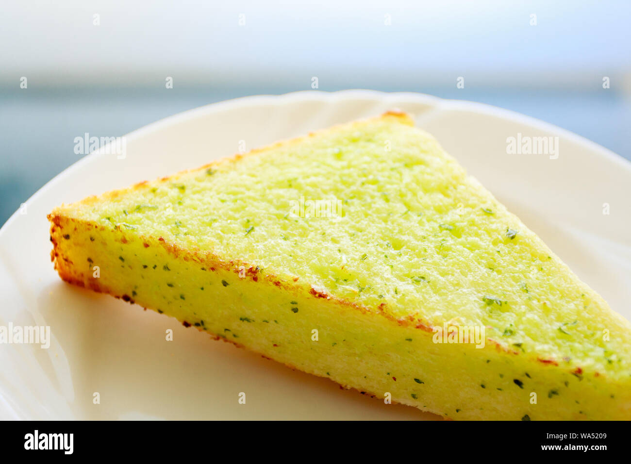 Delicious golden crispy toast with butter, garlic and parsley flakes ...