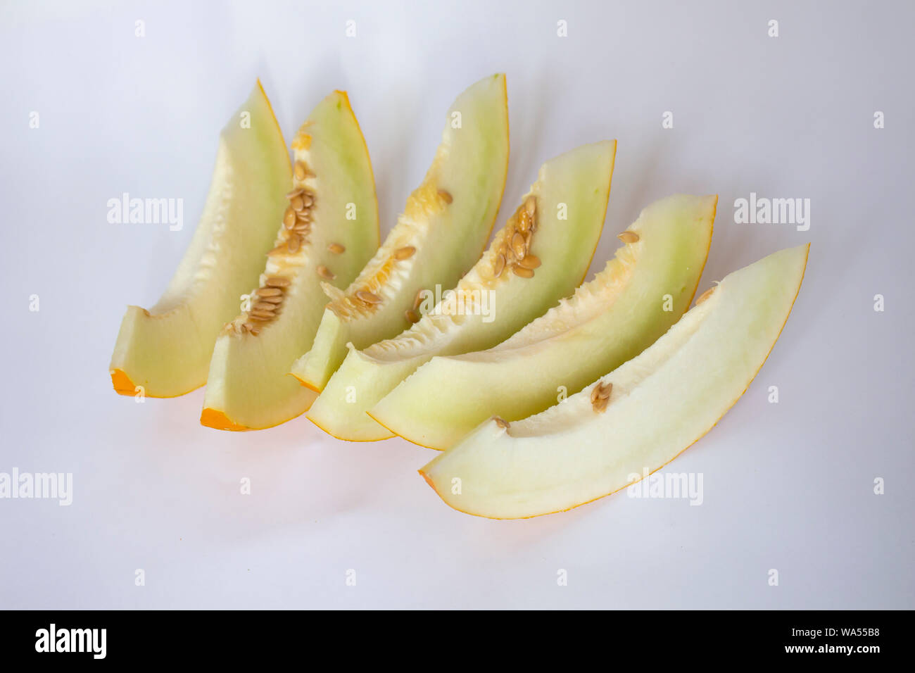 top view of a melon. melon sliced on a white background. veganism and ...
