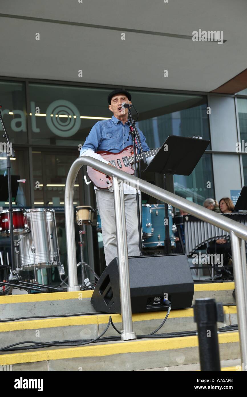People gather together in Manchester in memory of the people that died ...